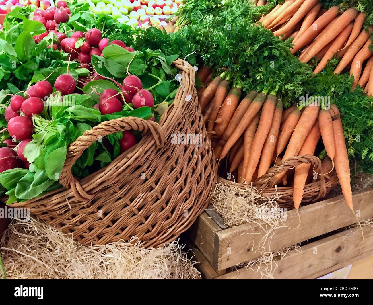 Fresh harvested organically grown vegetables stacked in market stall ...