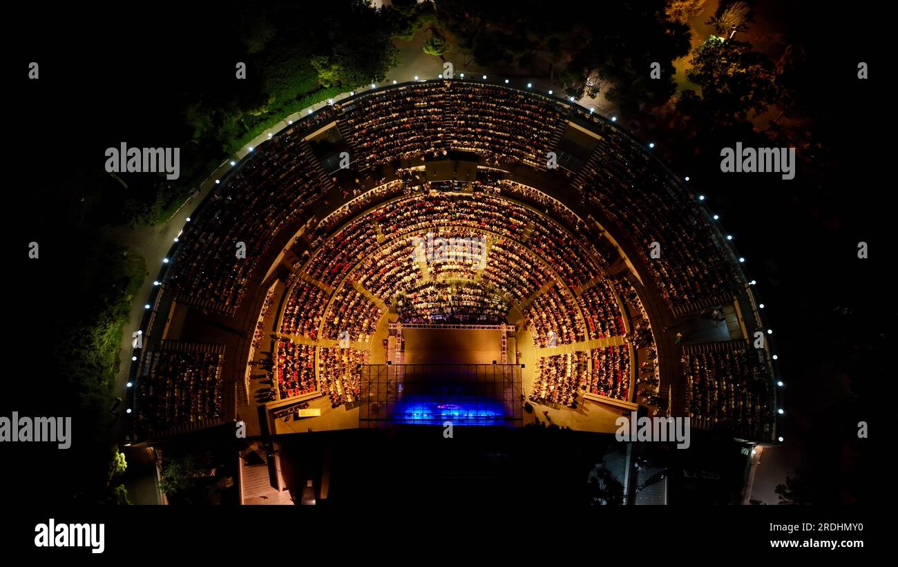 aerial view with drone of people watching concert and having fun in ...