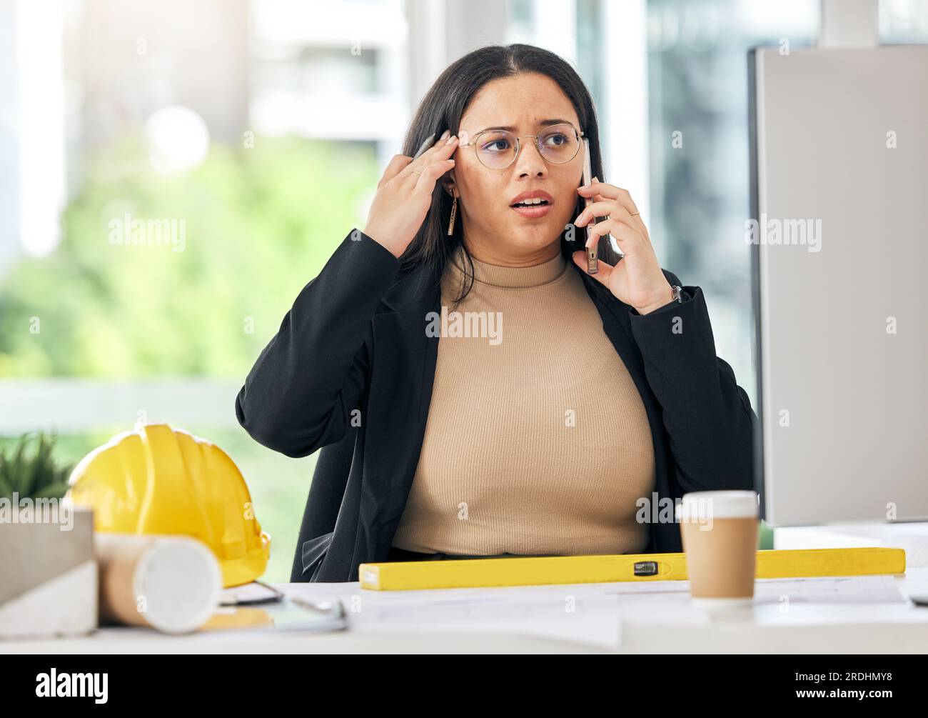 Stress, phone call and architecture with business woman in office for ...