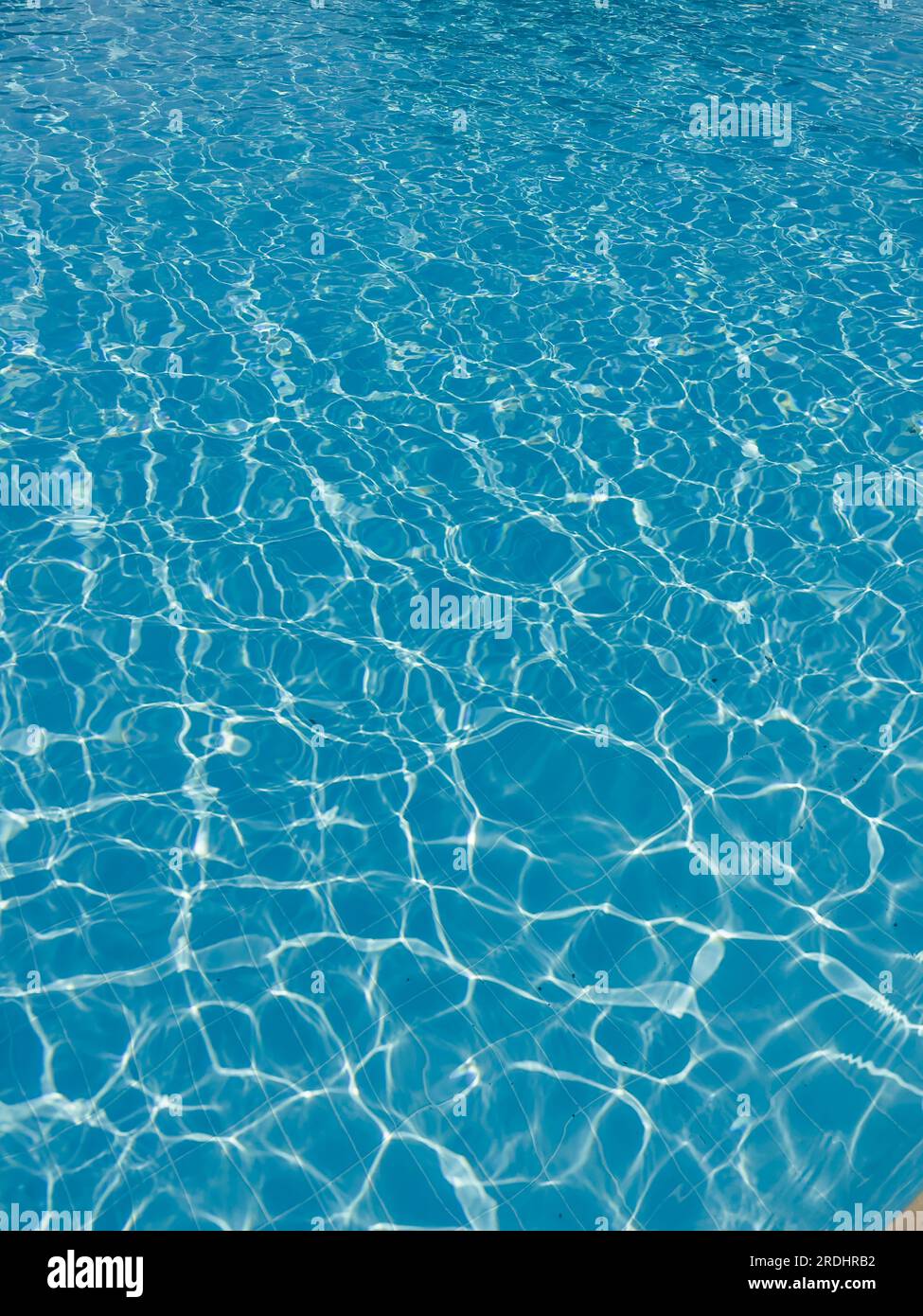 Water background, ripple and flow with waves. Summer blue swiming pool ...
