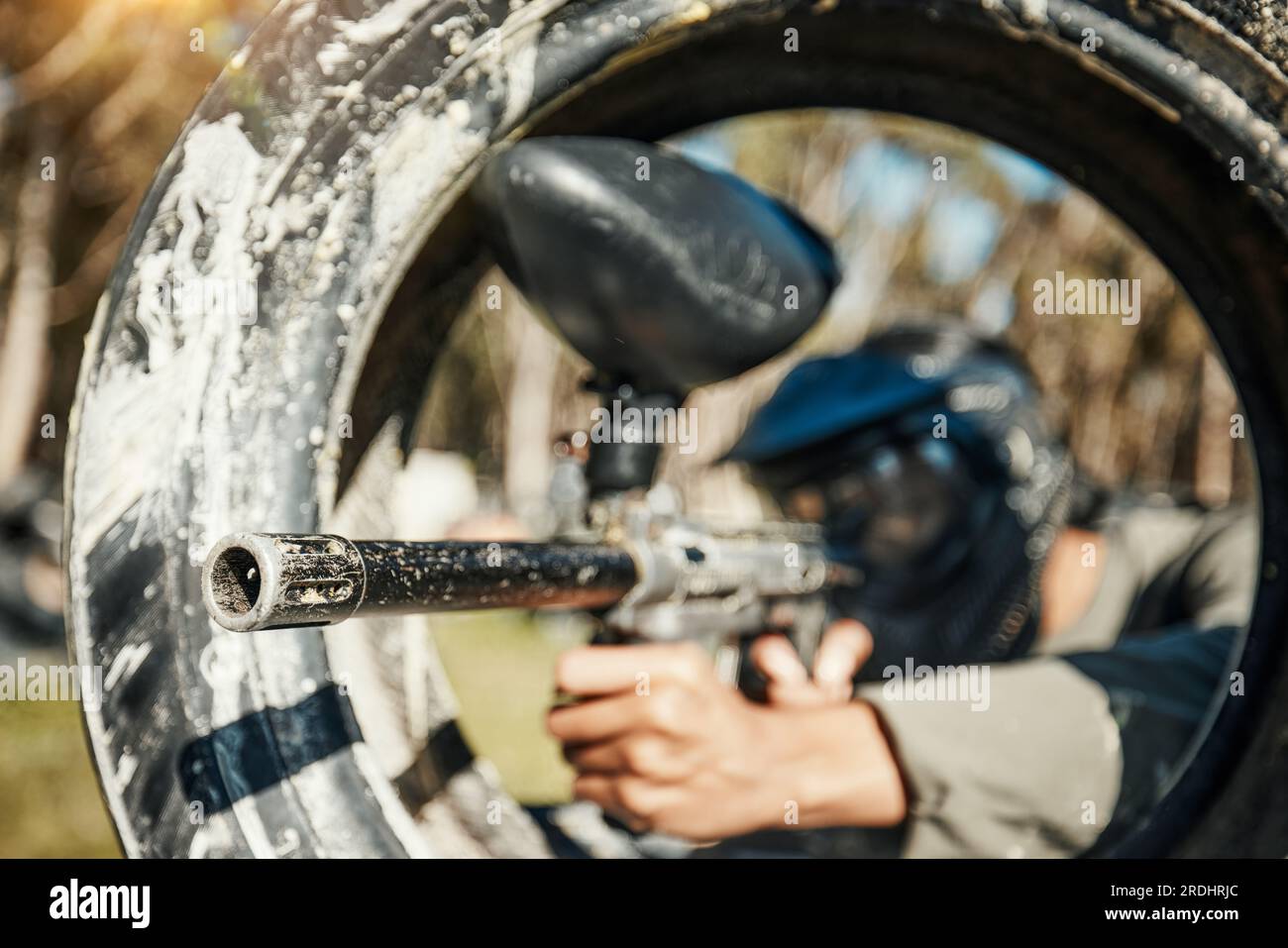 Paintball, shooting and target with man in playground for battlefield ...