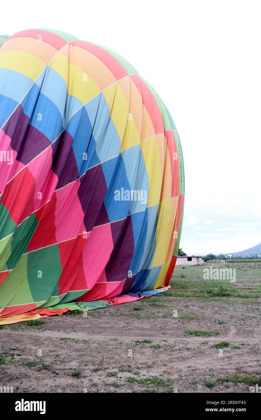 Process of inflation and preparation of hot air balloon at sunrise for ...