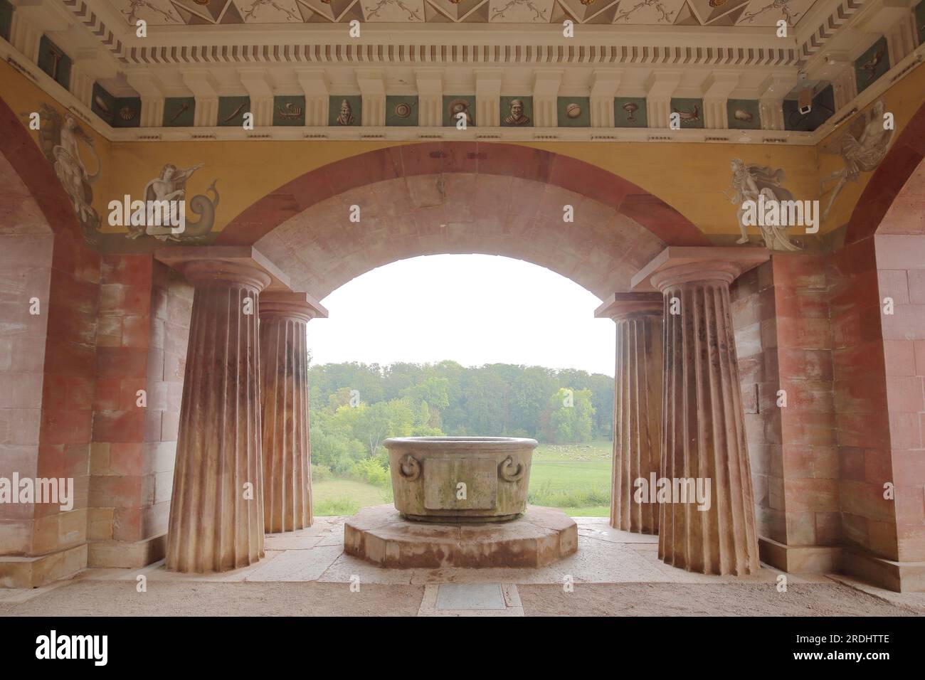 Pillars with fluting with decorations, ornaments and water basins ...