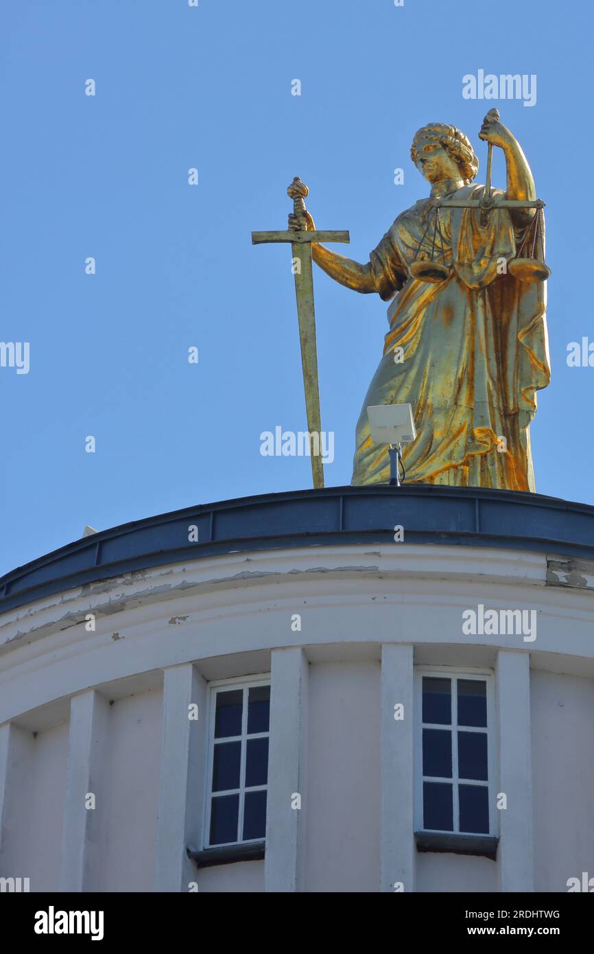 Golden sculpture Themis with sword and scales - Greek goddess of ...