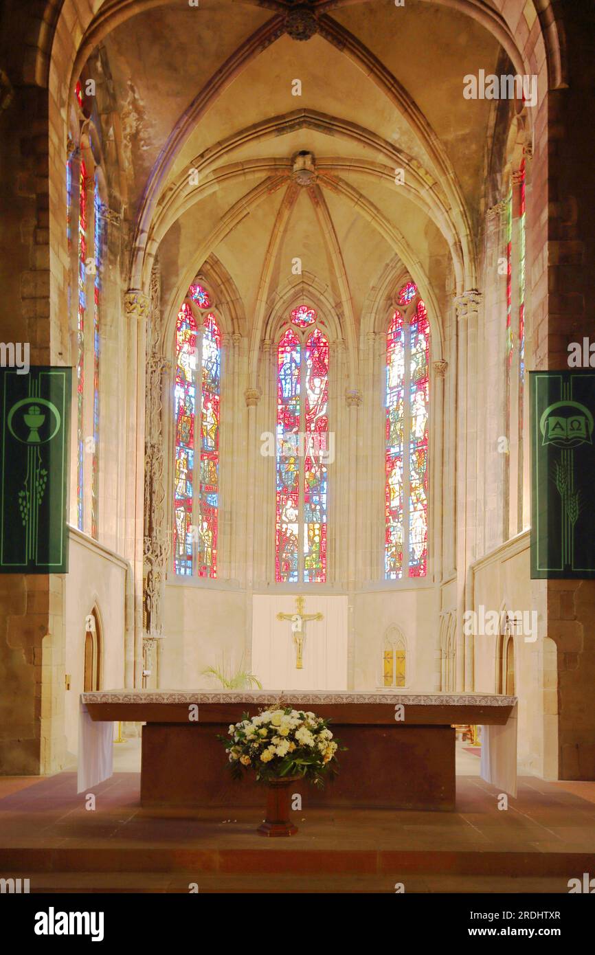 Interior view with altar and stained glass window of the Gothic St ...