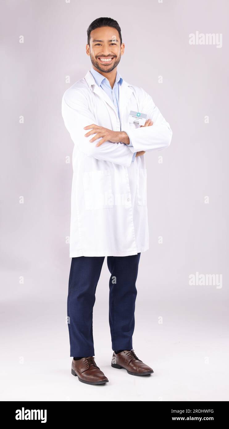 Portrait, man and happy scientist with arms crossed in studio isolated ...