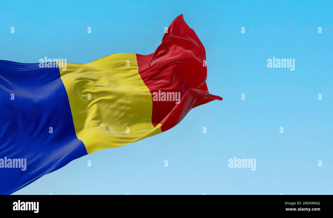 National flag of Romania waving in the wind on a clear day. Vertical ...