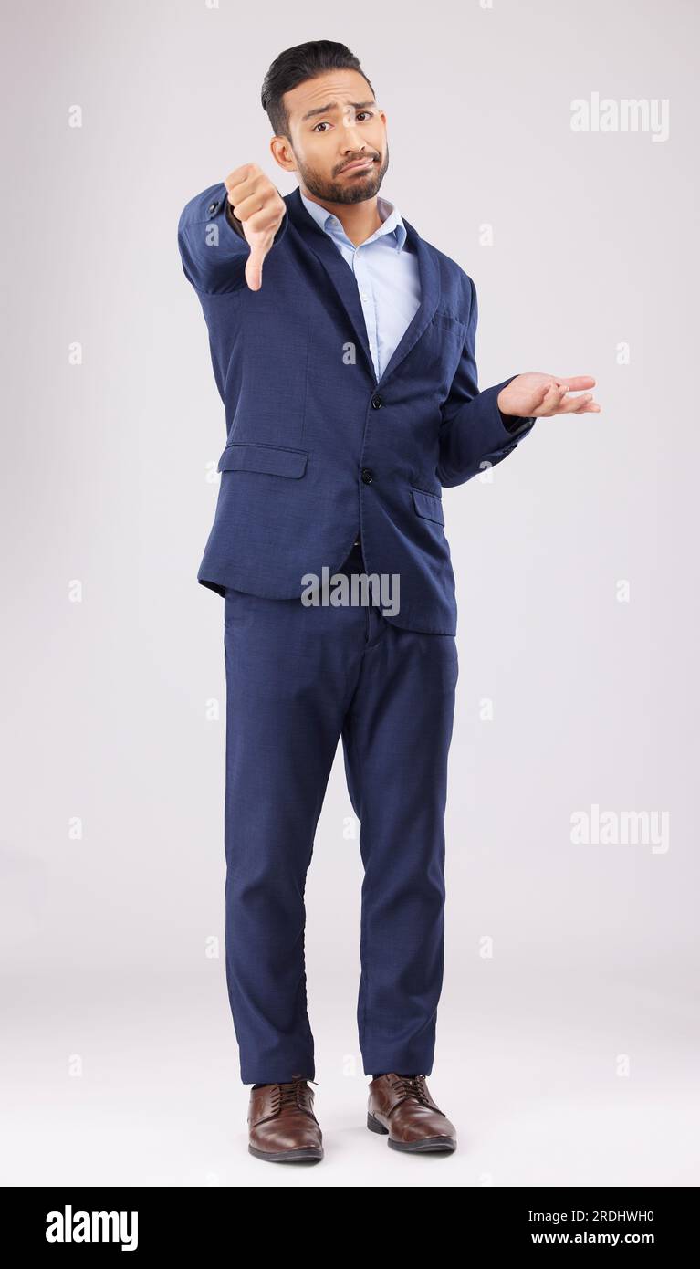 Portrait, thumbs down and confused business man with negative fail sign ...