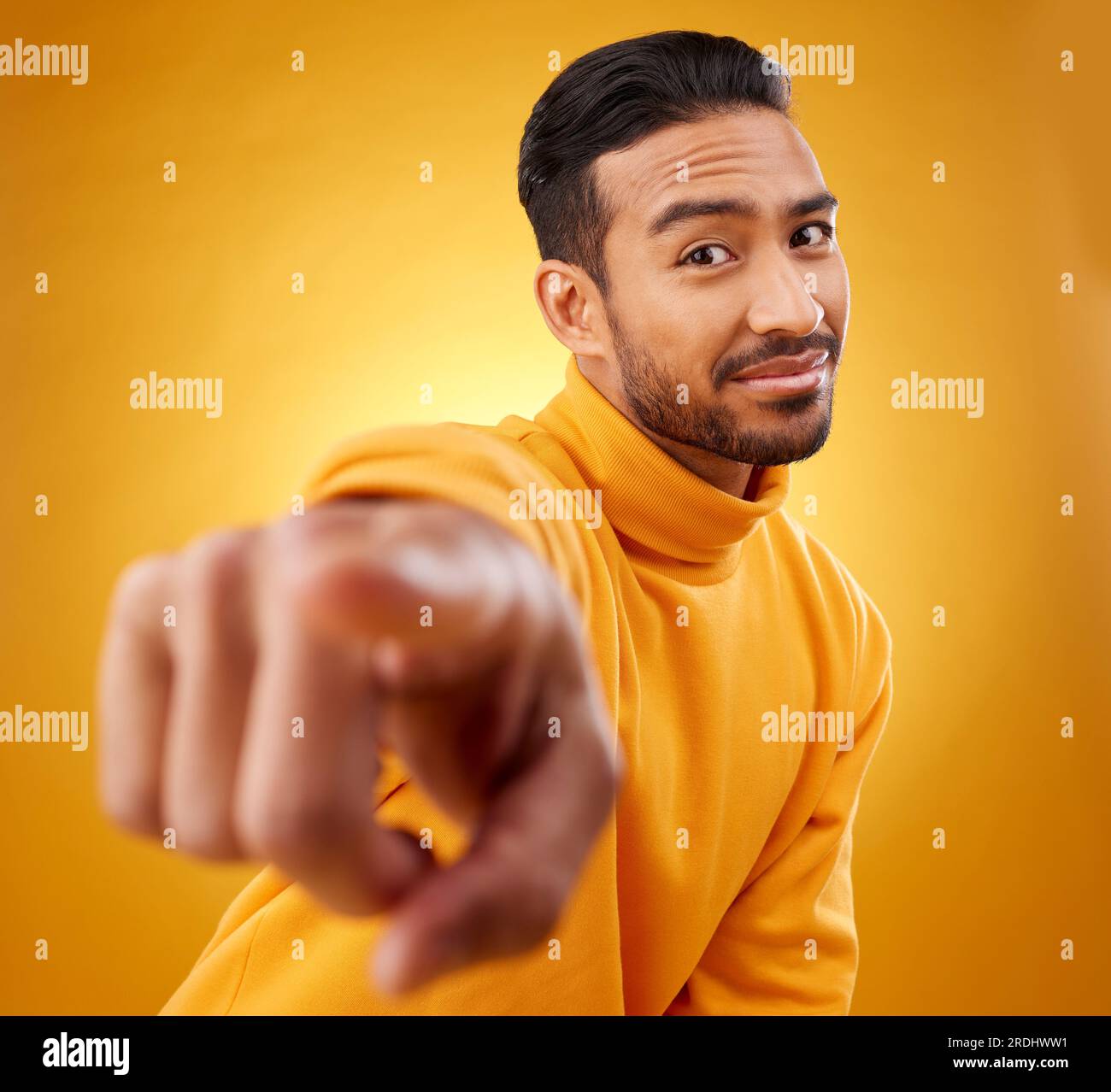 Portrait, asian man and hand pointing in studio with you, sign or thank ...