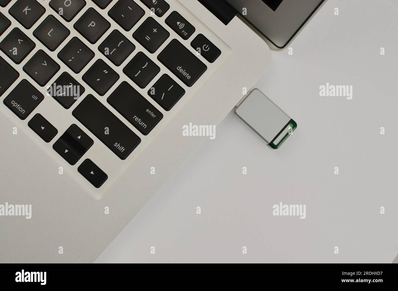 Closeup of USB stick connected to laptop, illustrating the importance ...