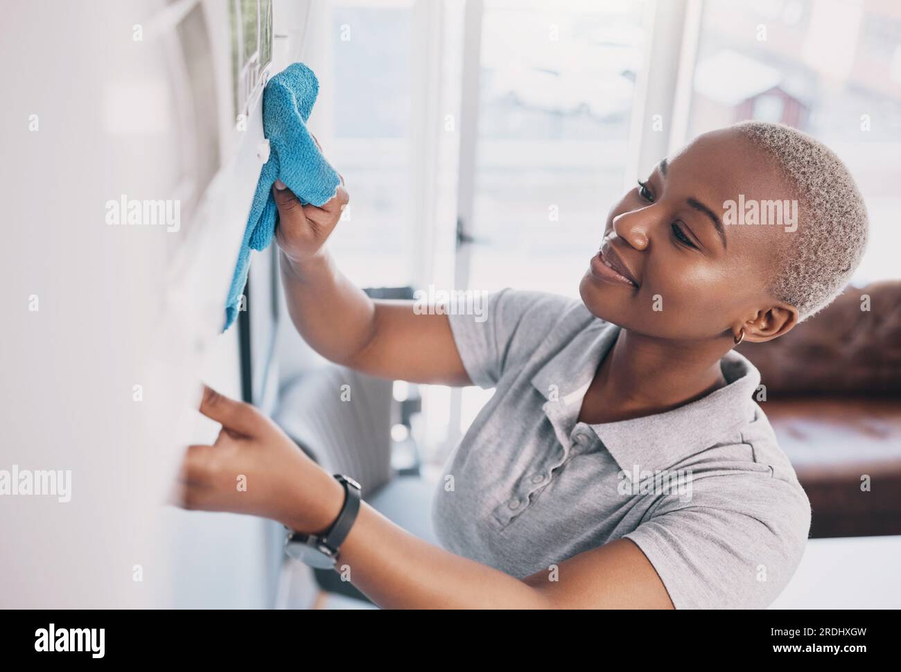Cleaning, happy and dust with black woman in living rom for ...