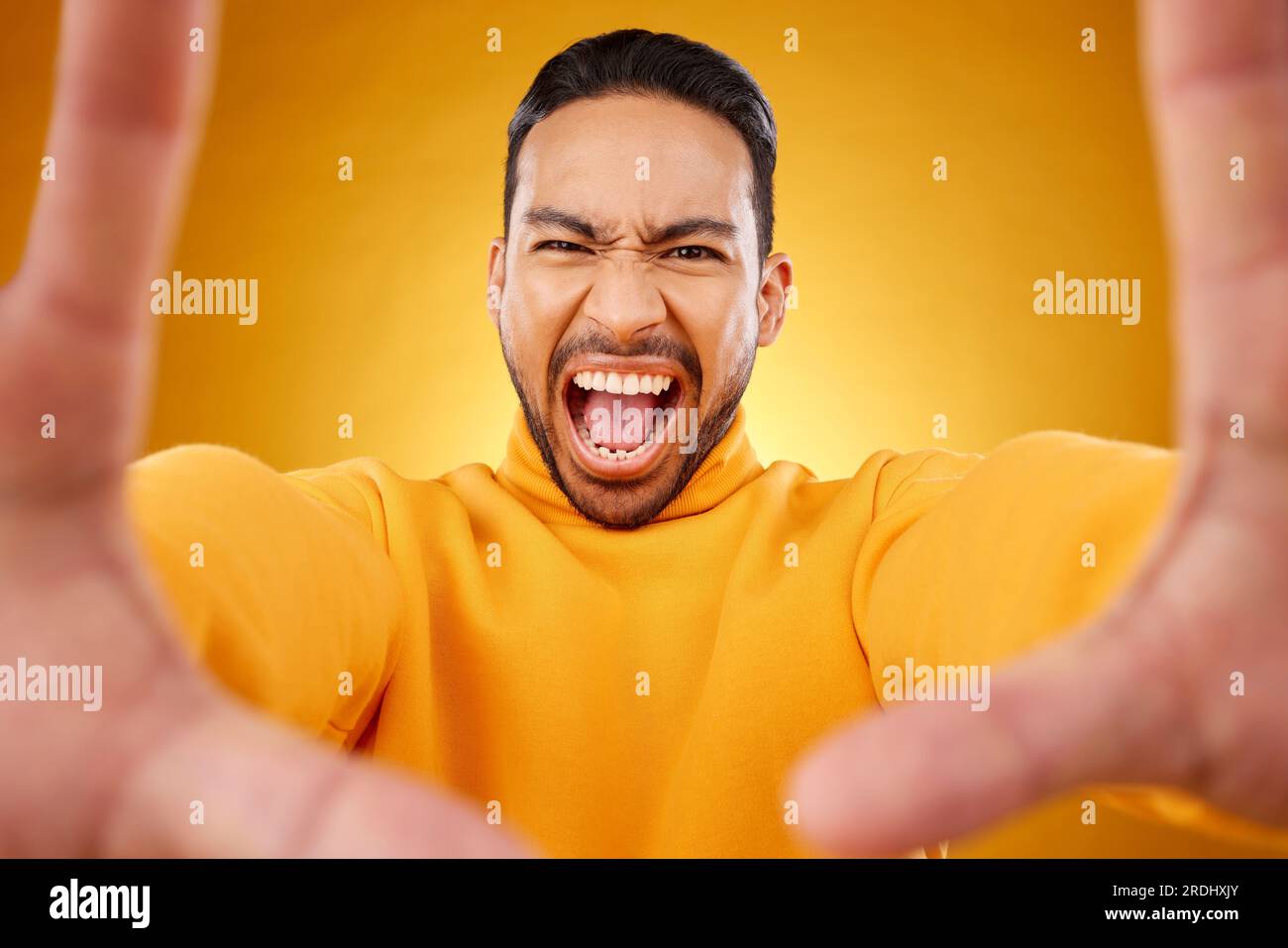 Shouting, portrait and selfie of angry man in studio isolated on a ...