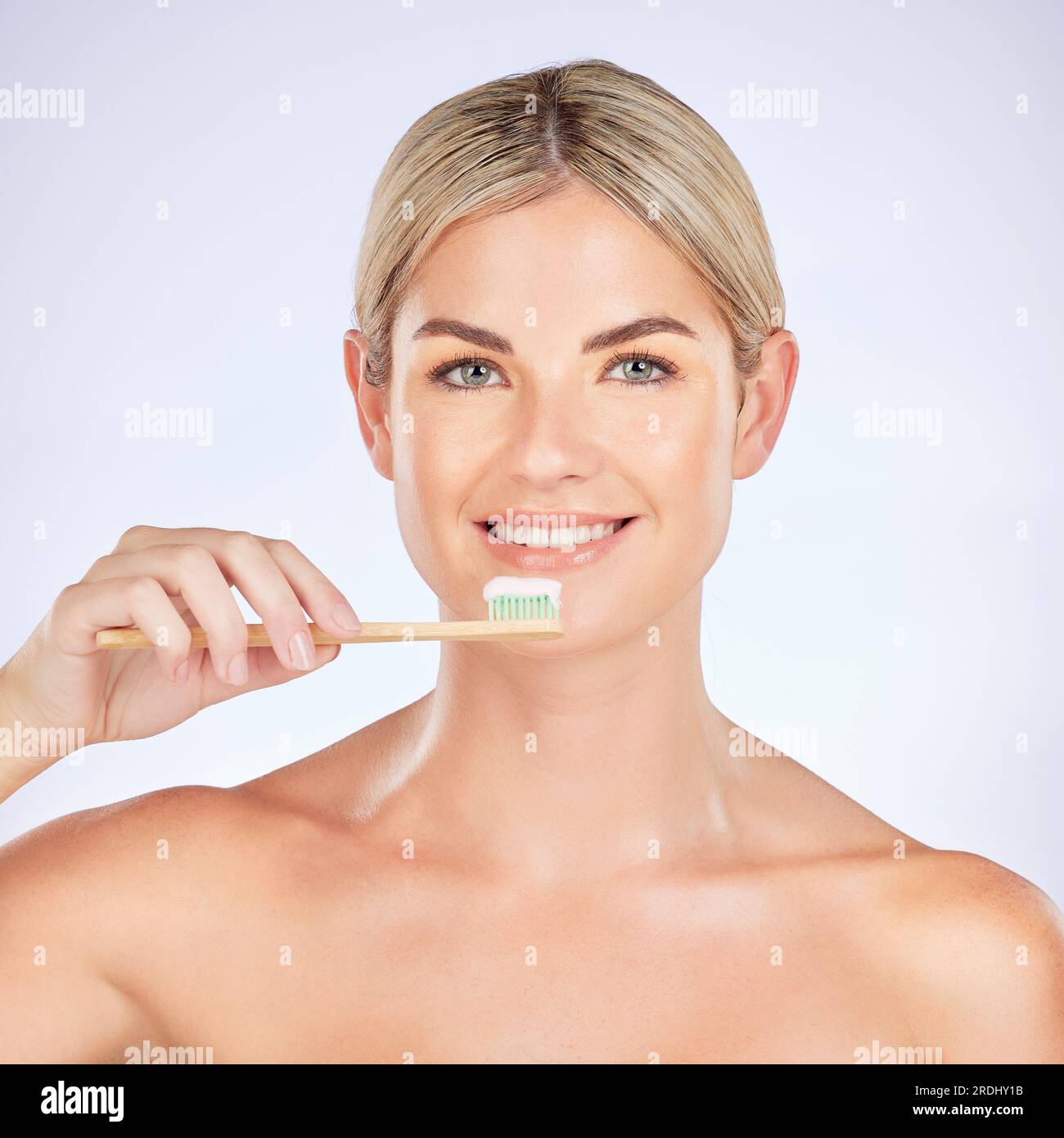 Portrait, woman and brushing teeth in studio for healthy dental ...