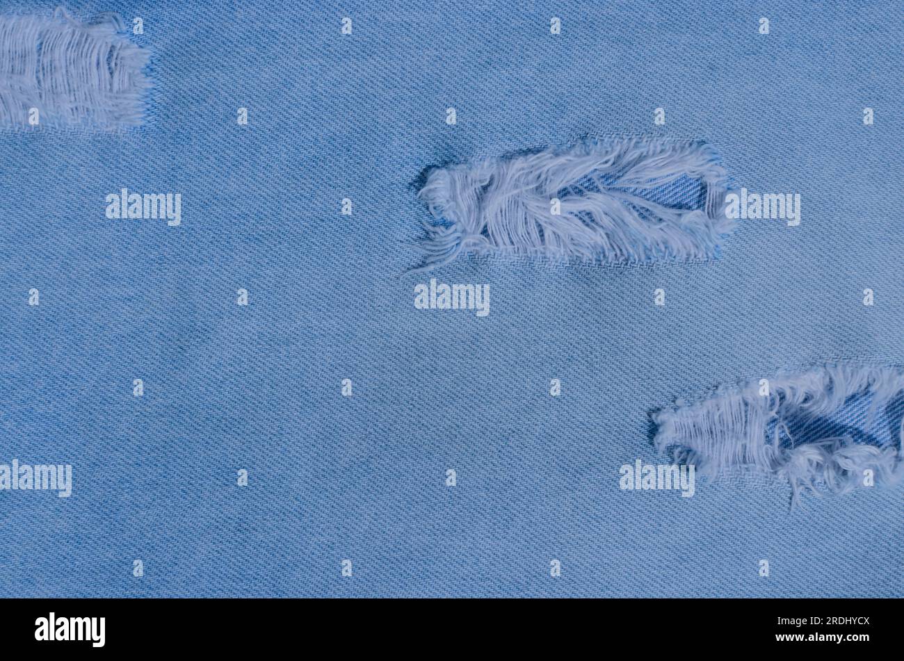 Close-up of a denim texture with intertwined lines, revealing the ...
