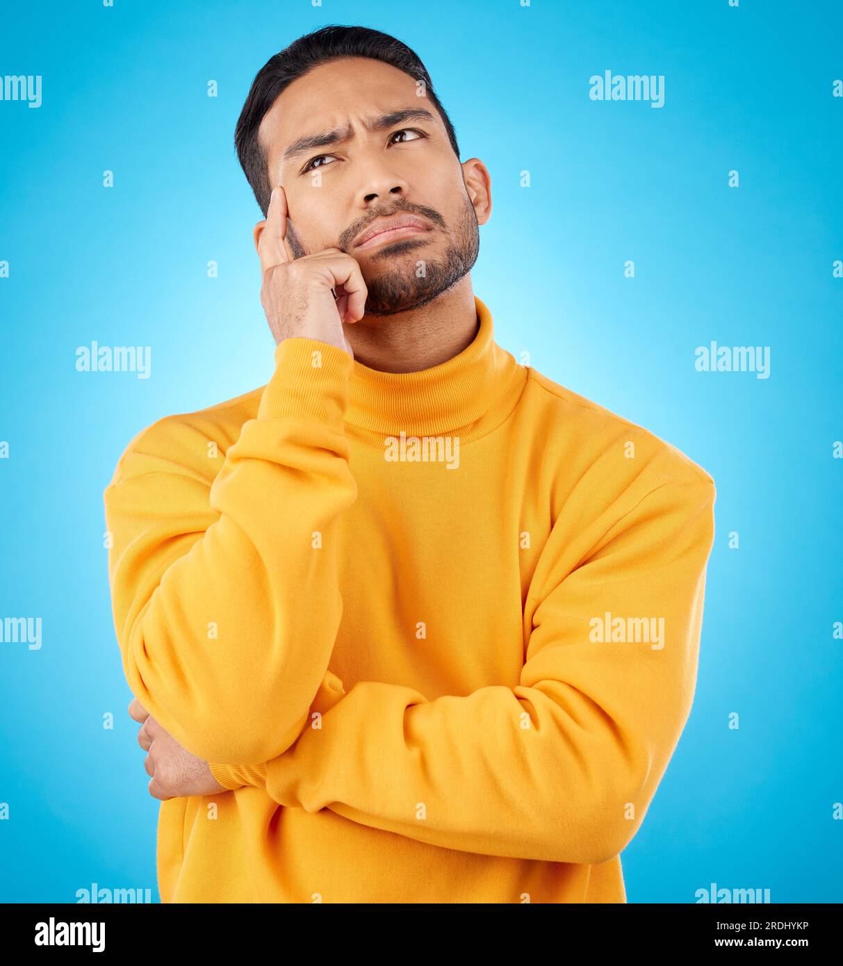 Thinking, idea and young man in a studio with doubt, confused or choice ...