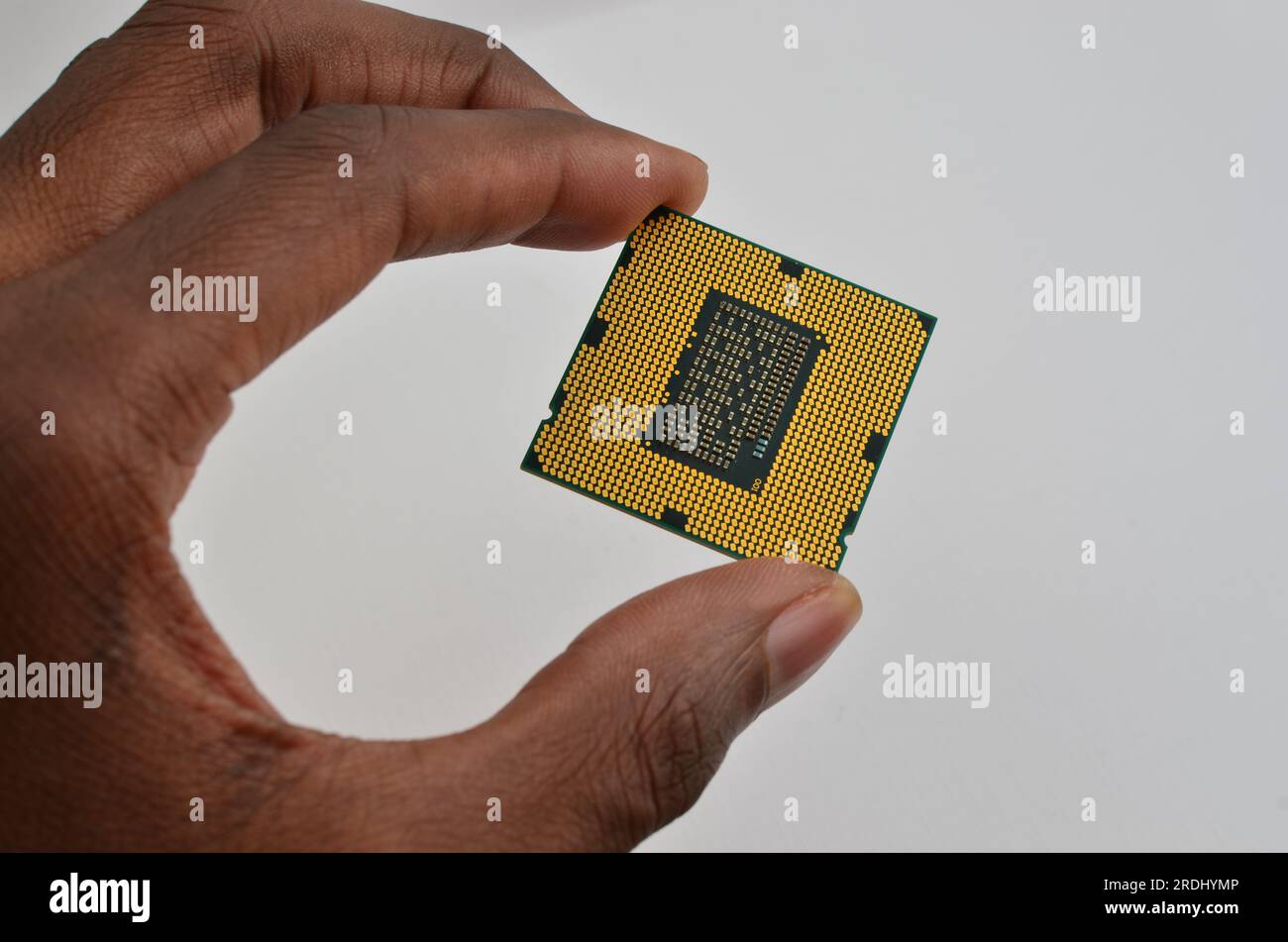 Impressive close-up of a hand holding a processor, illustrating the ...