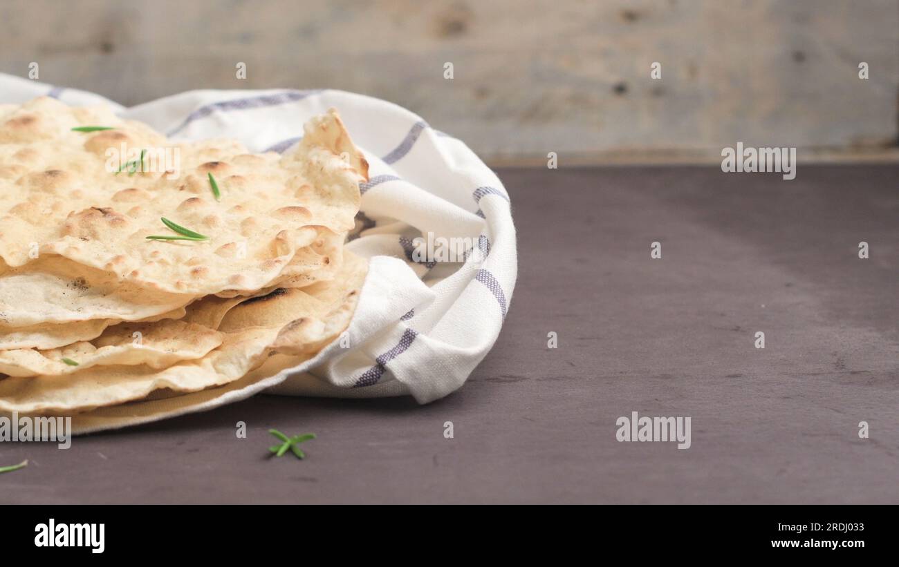 Homemade hot chapati on kitchen countertop background. Slide from left ...