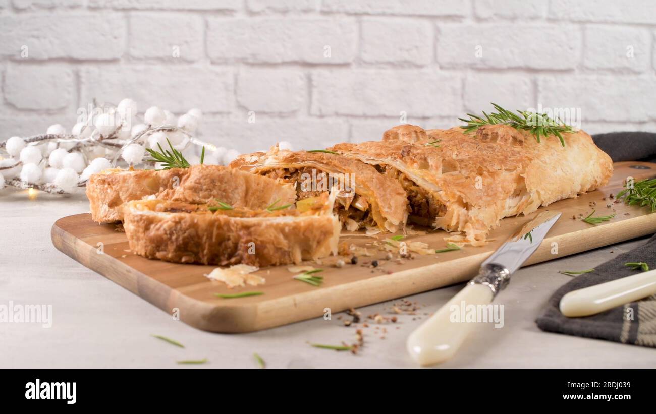 Puff pastry vegetable roll on kitchen decorated countertop Stock Photo ...