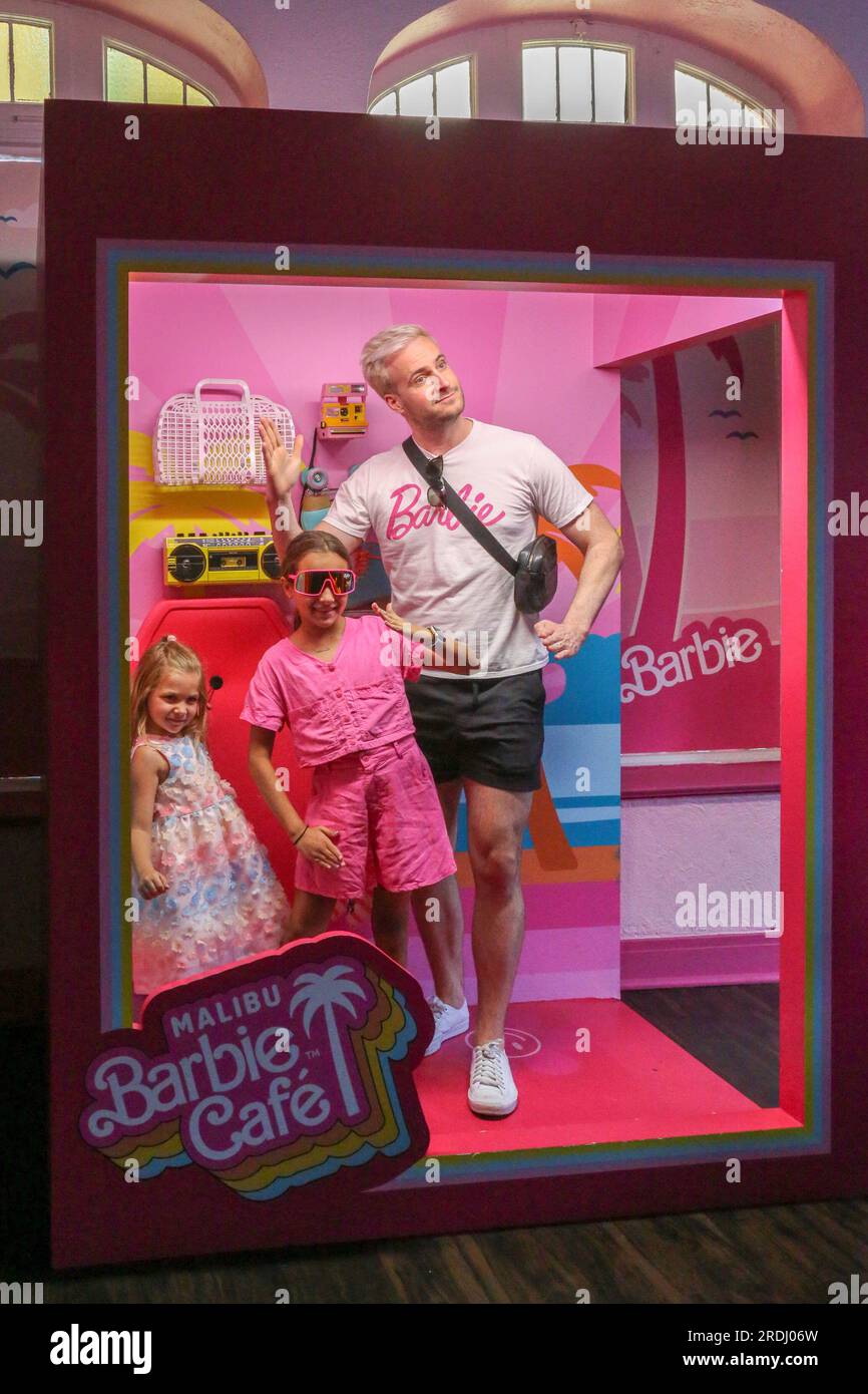 People dressed in Barbie themed attire pose for selfies in the life ...