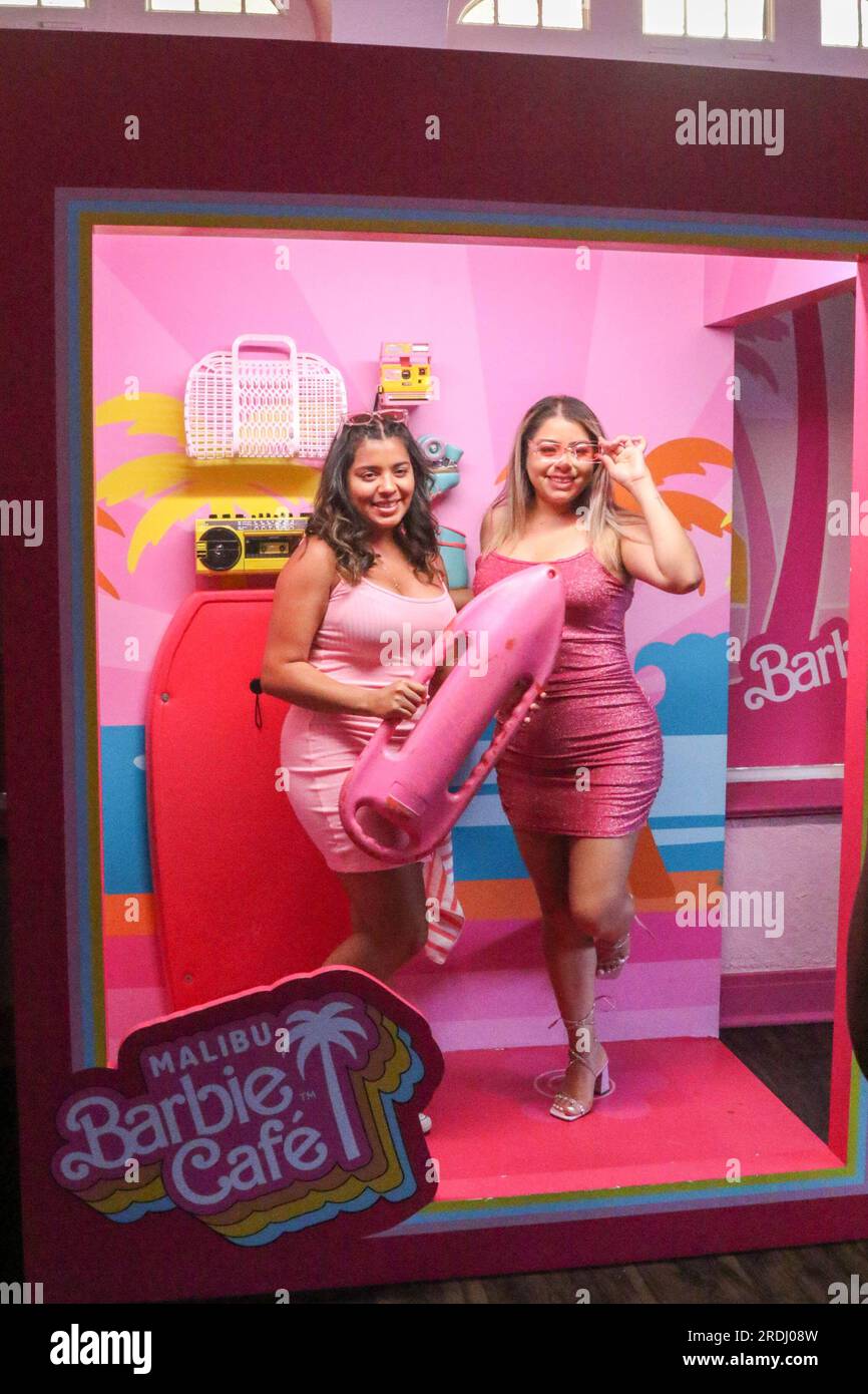 People dressed in Barbie themed attire pose for selfies in the life ...