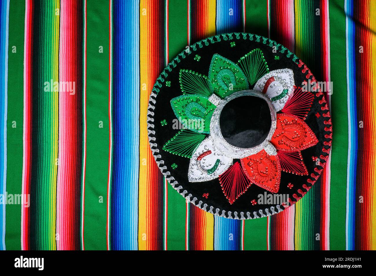 Mariachi hat with the colors of the Mexican flag on a colorful serape ...