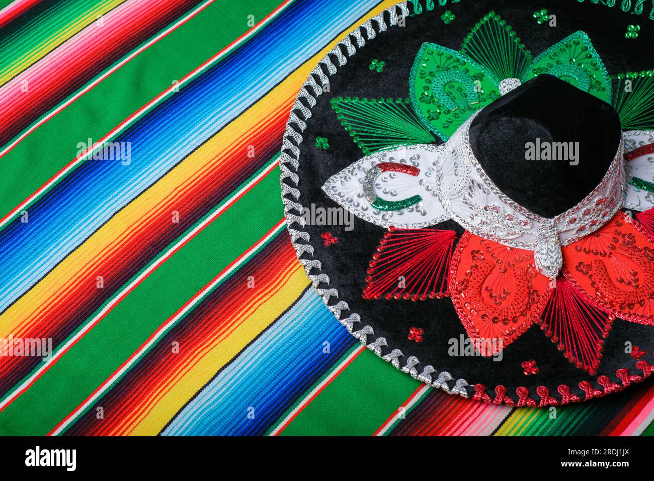 Mariachi hat with the colors of the Mexican flag on a colorful serape ...