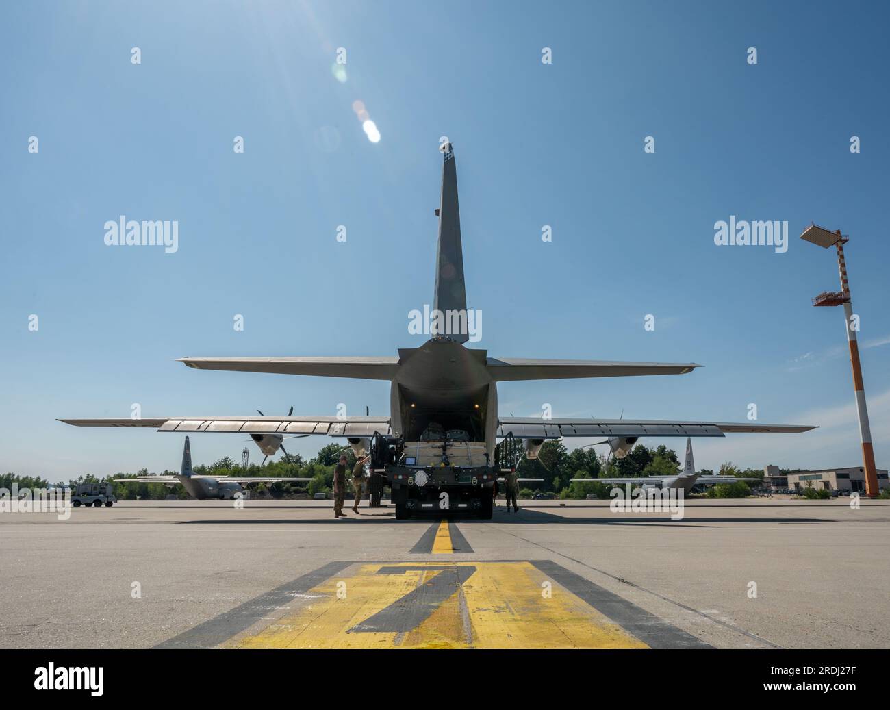 Members of the 86th Logistics Readiness Squadron load cargo on a U.S ...
