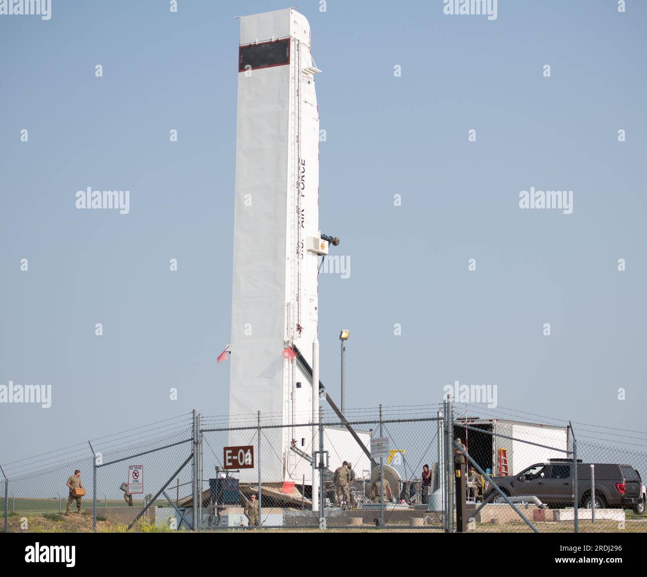 Airmen from the 91st Missile Maintenance Squadron raise a transport ...