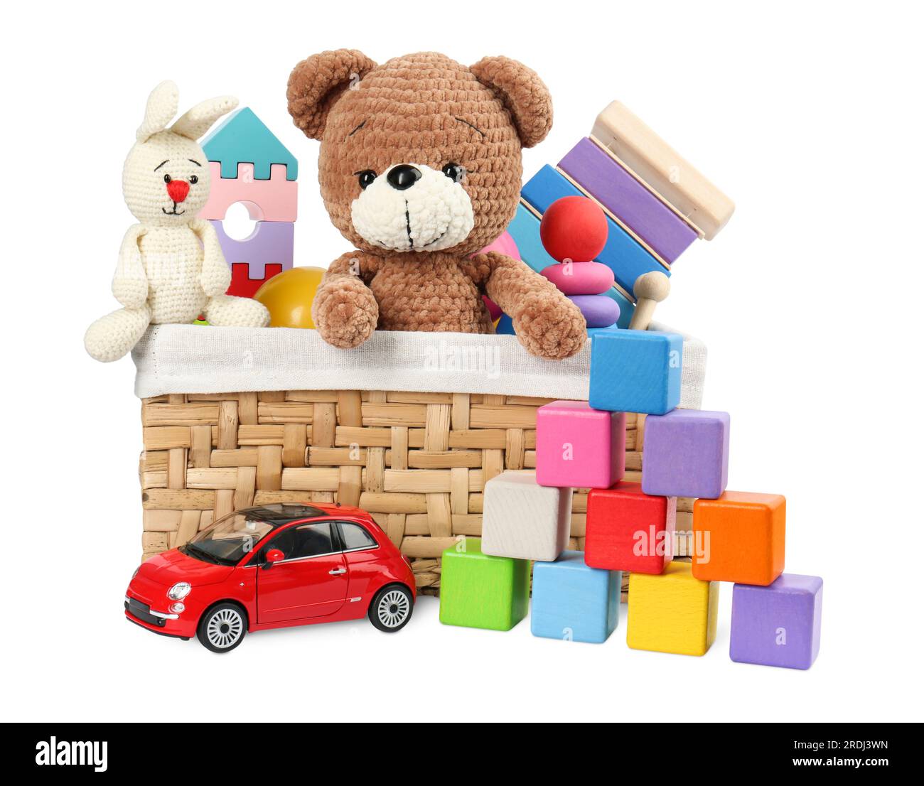 Many different children's toys and wicker basket isolated on white ...