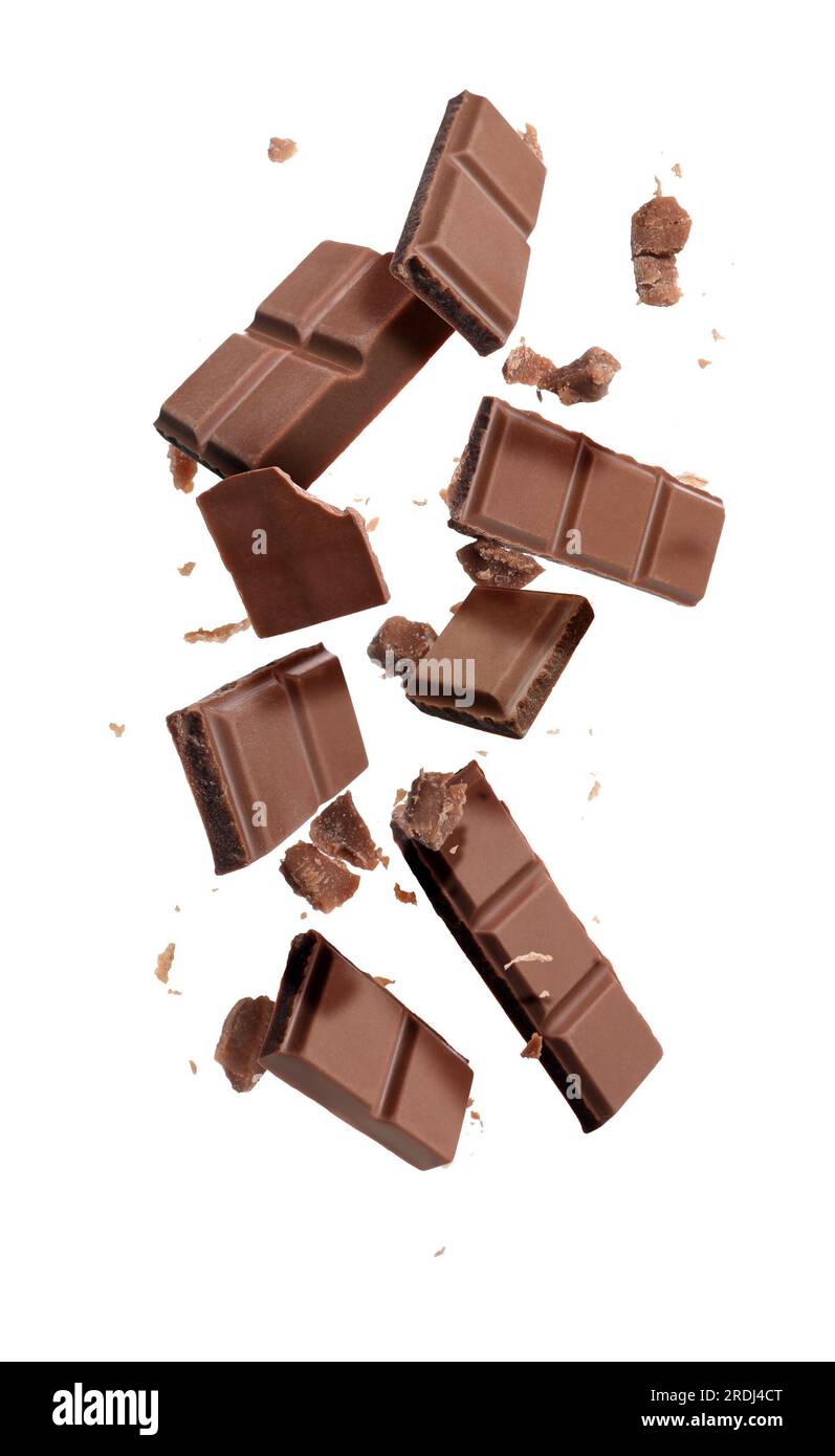 Broken chocolate bar pieces falling on white background Stock Photo - Alamy