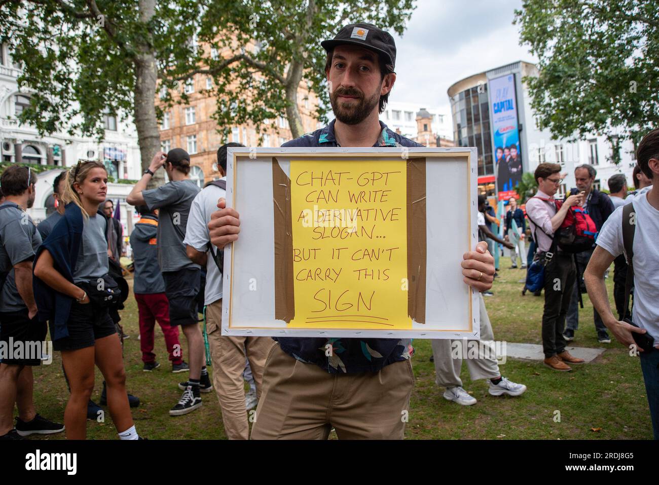 London, UK. 21st July, 2023. A protester poses for a photo with a ...