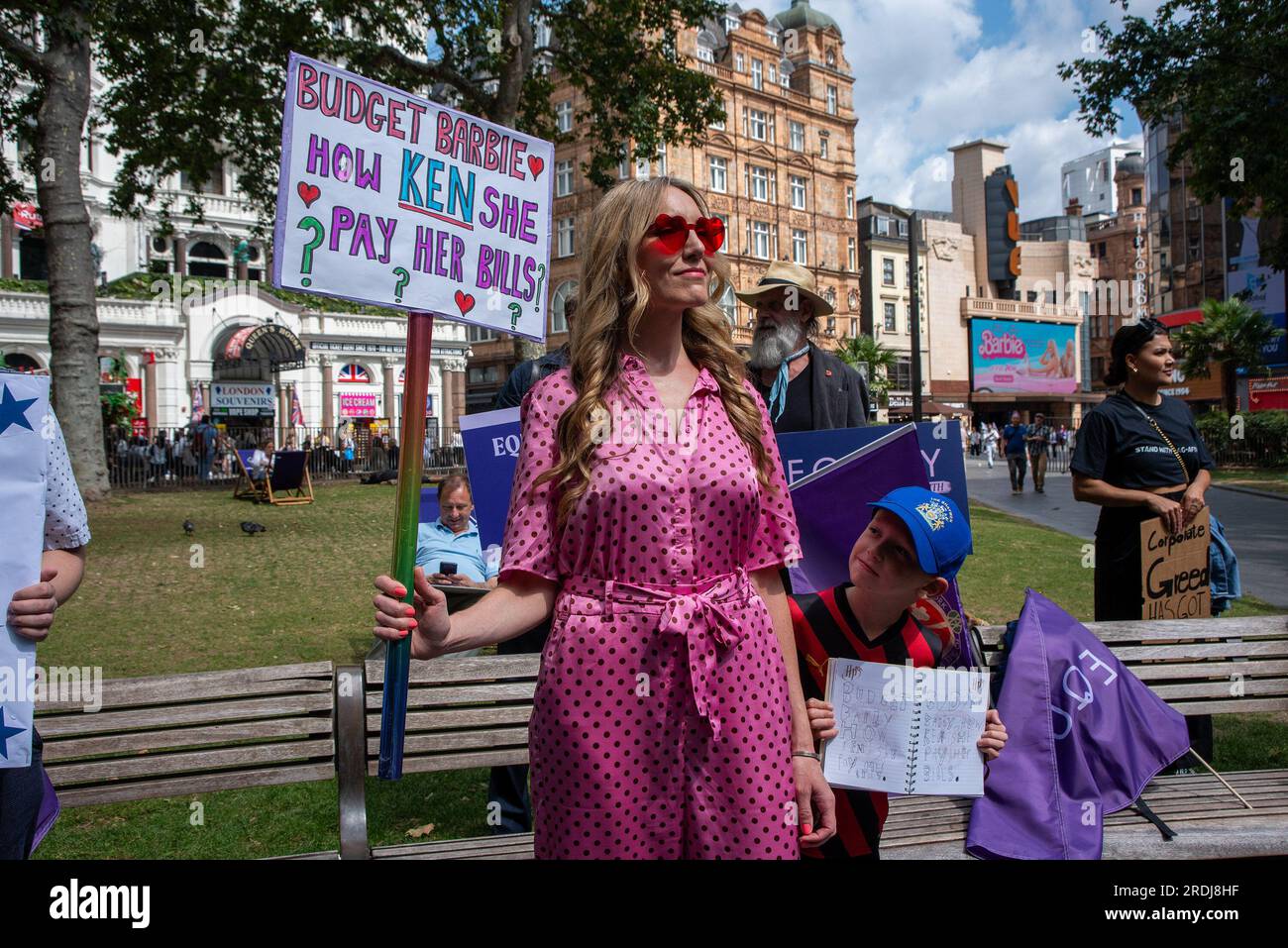 London, UK. 21st July, 2023. A protester dressed as Barbie holds a ...