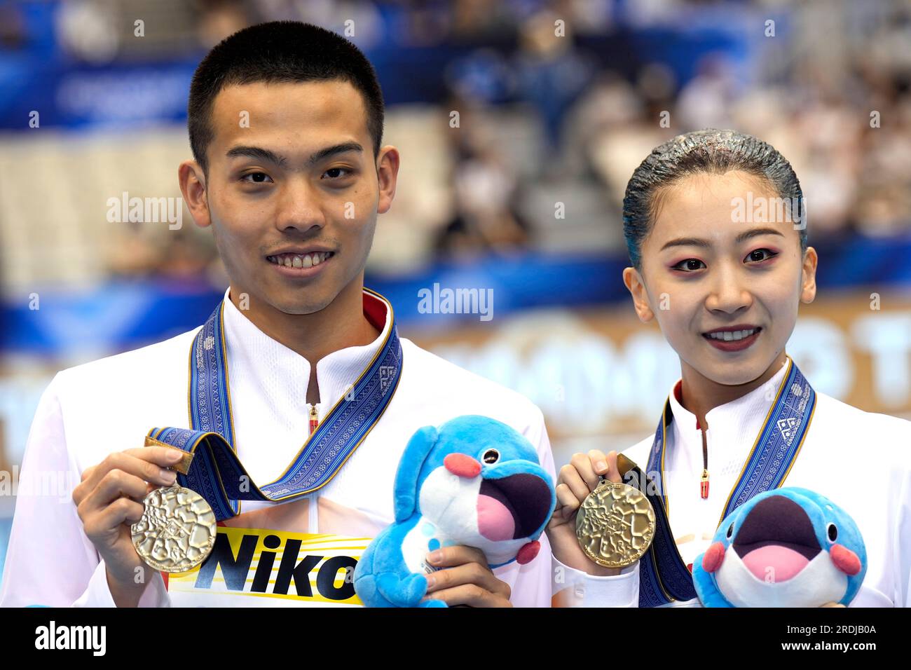 Shi Haoyu and Cheng Wentao, of China, hold their gold medals after ...