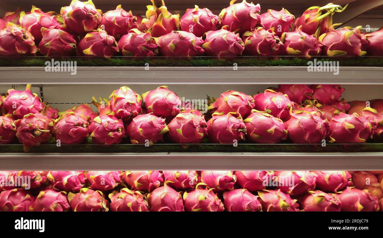 Dragon fruit displayed at supermarket aisle Stock Photo - Alamy