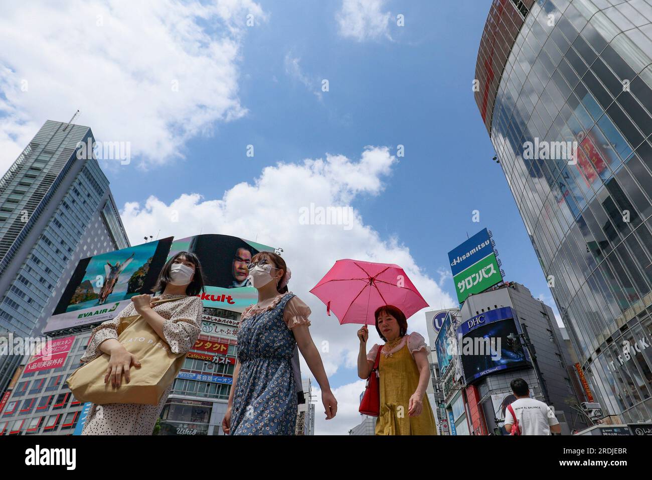 People walk on a street in Shibuya Ward, Tokyo, on July 22, 2023. The ...