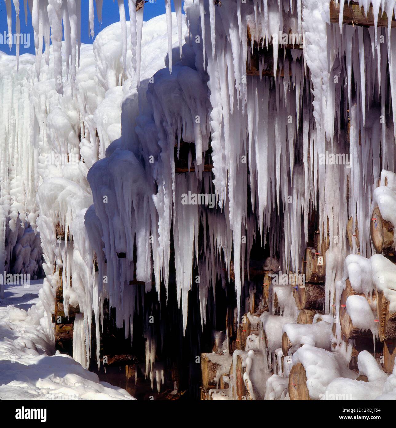 Icicles, ice structures on a pile of wood Stock Photo - Alamy