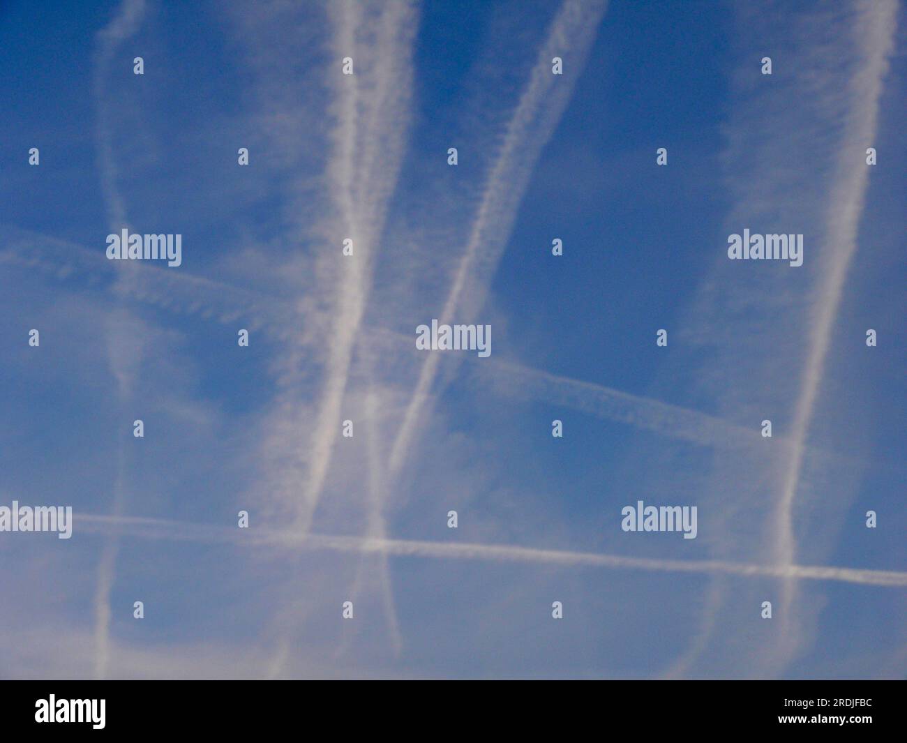 Condensation trails in the sky caused by aircraft Stock Photo - Alamy