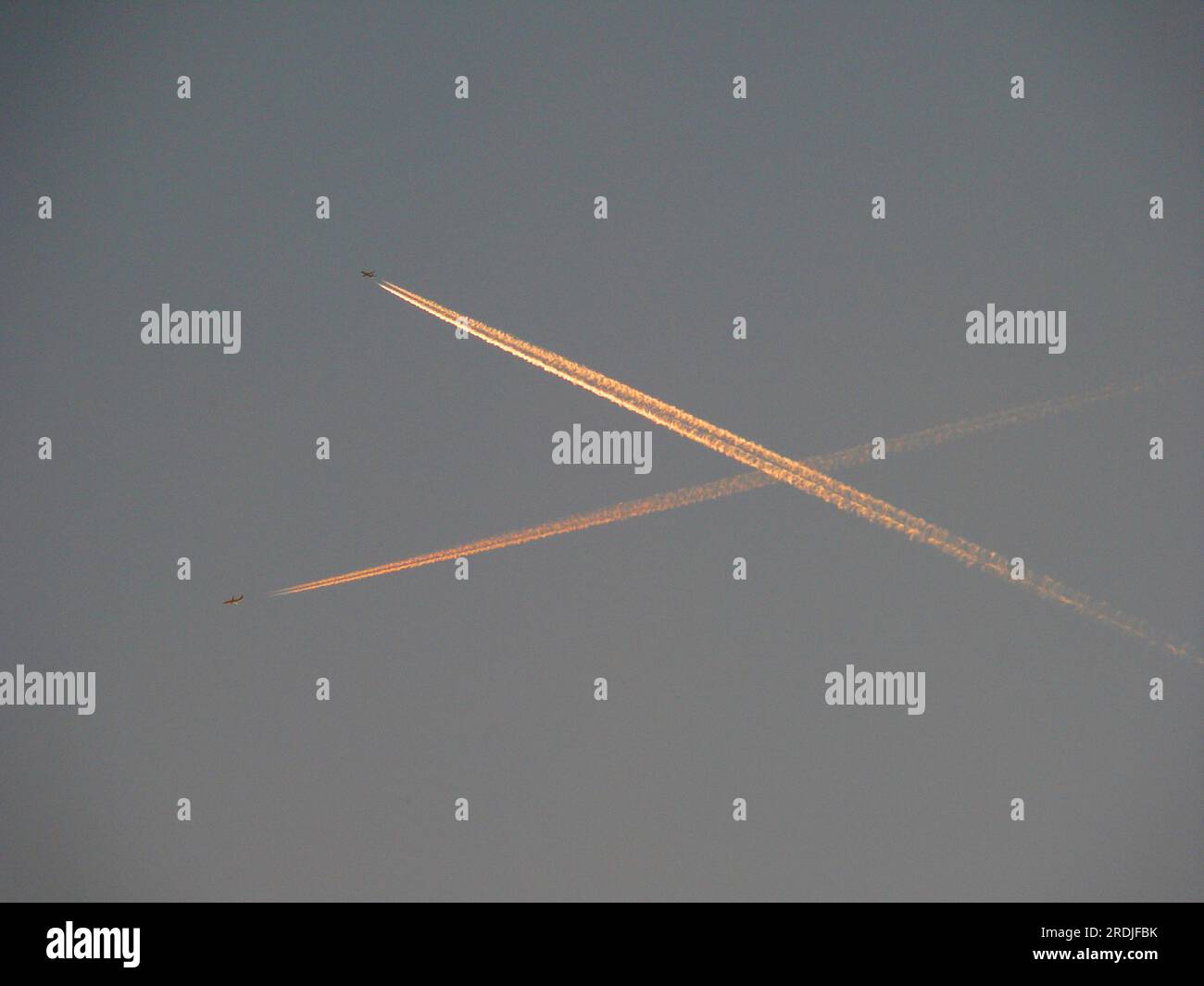 2 jets cross in the sky Stock Photo - Alamy