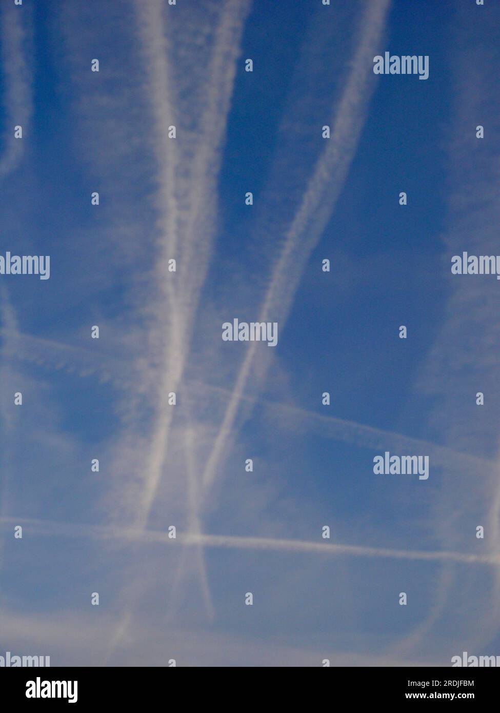 Condensation trails in the sky caused by aircraft Stock Photo - Alamy