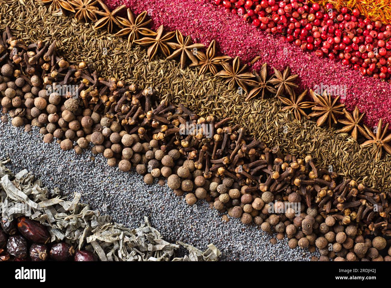 collection of condiments scattered on the table. Spice background for ...