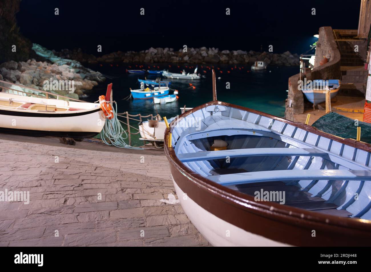 Traditional Mediterranean Boat on dock at Riomaggiore in Cinque Terre ...