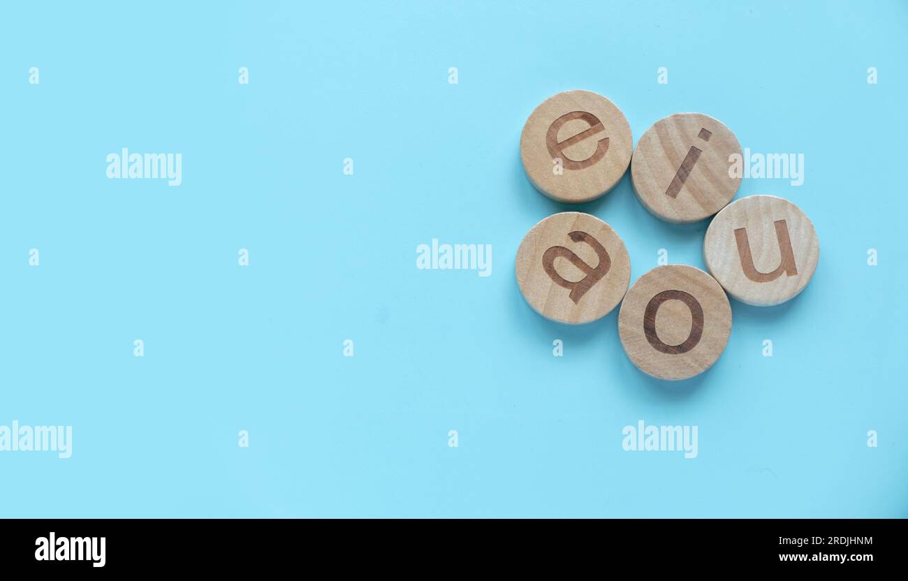 Learning english concept.Vowels of AEIOU on a blue background. Copy ...