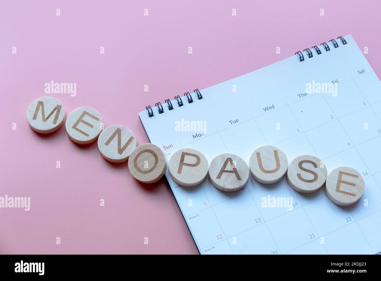 Alphabet form a word menopause over a calendar. Healthcare and medical ...