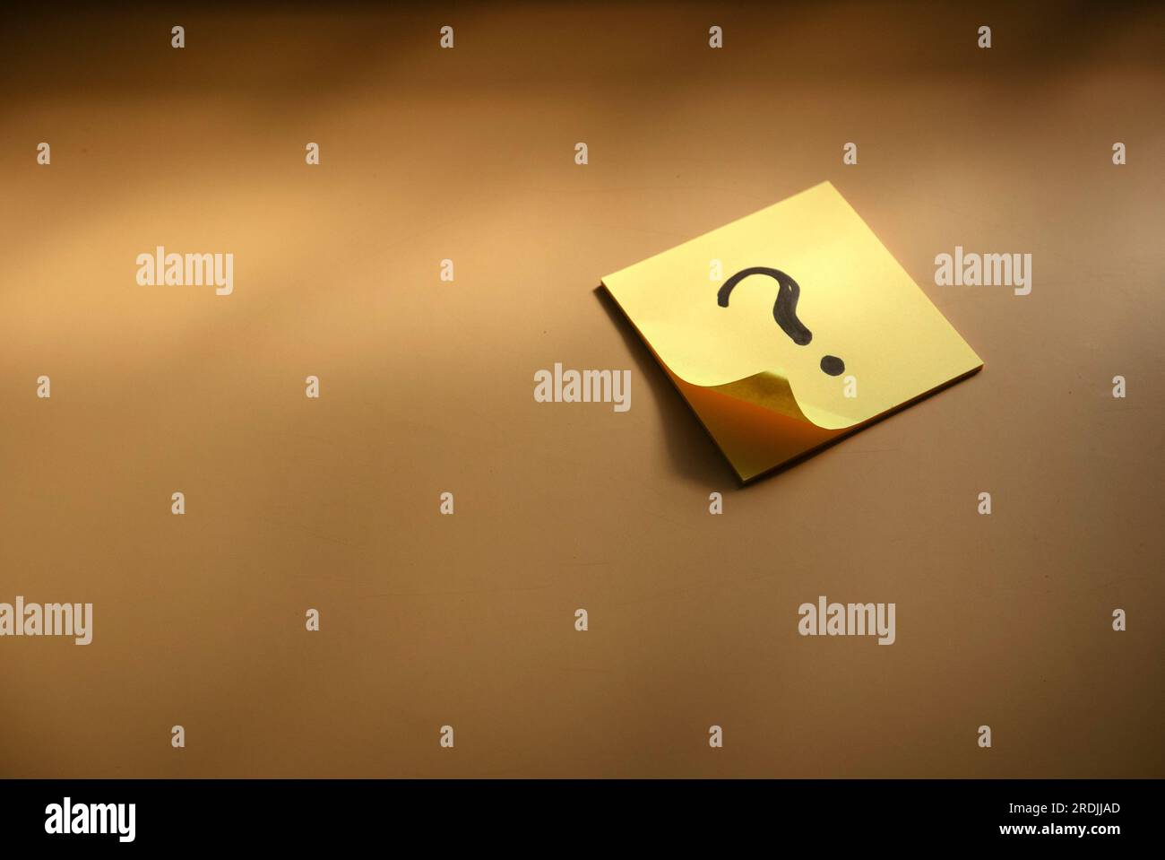 Questions and answer concept. Question mark written on paper. Brown ...