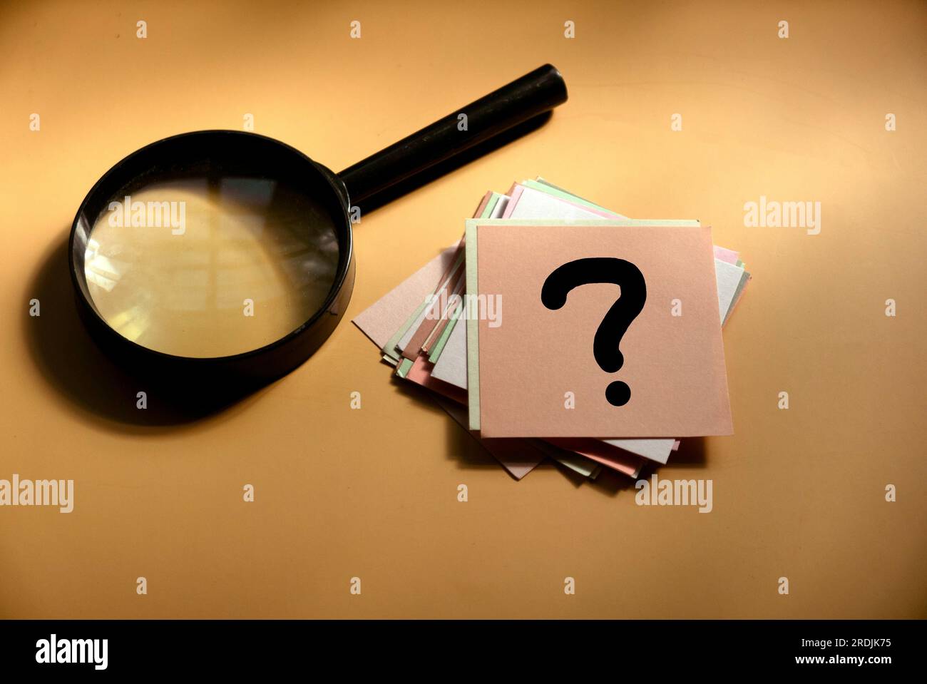 Questions and answer concept. Question mark written on paper. Brown ...