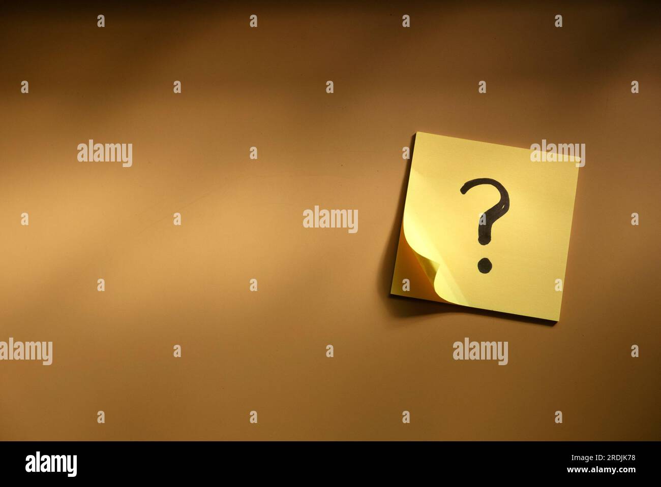 Questions and answer concept. Question mark written on paper. Brown ...