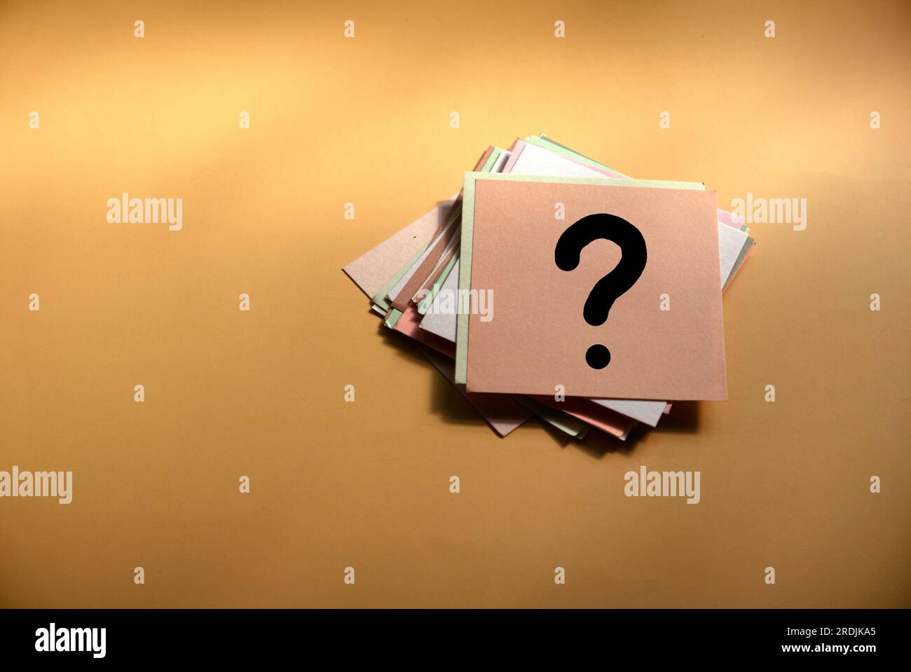 Questions and answer concept. Question mark written on paper. Brown ...