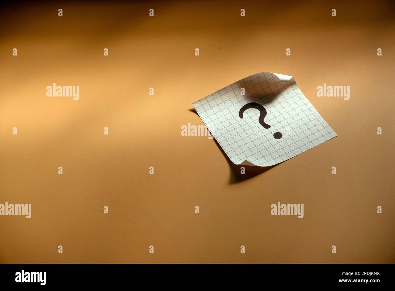 Questions and answer concept. Question mark written on paper. Brown ...