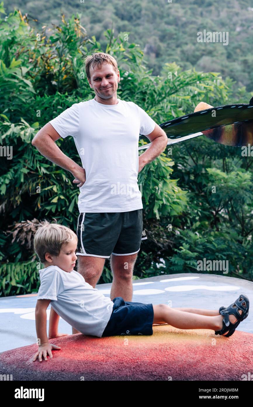 Happiness with dad. Father's Day. Raising son. Man smiling standing ...