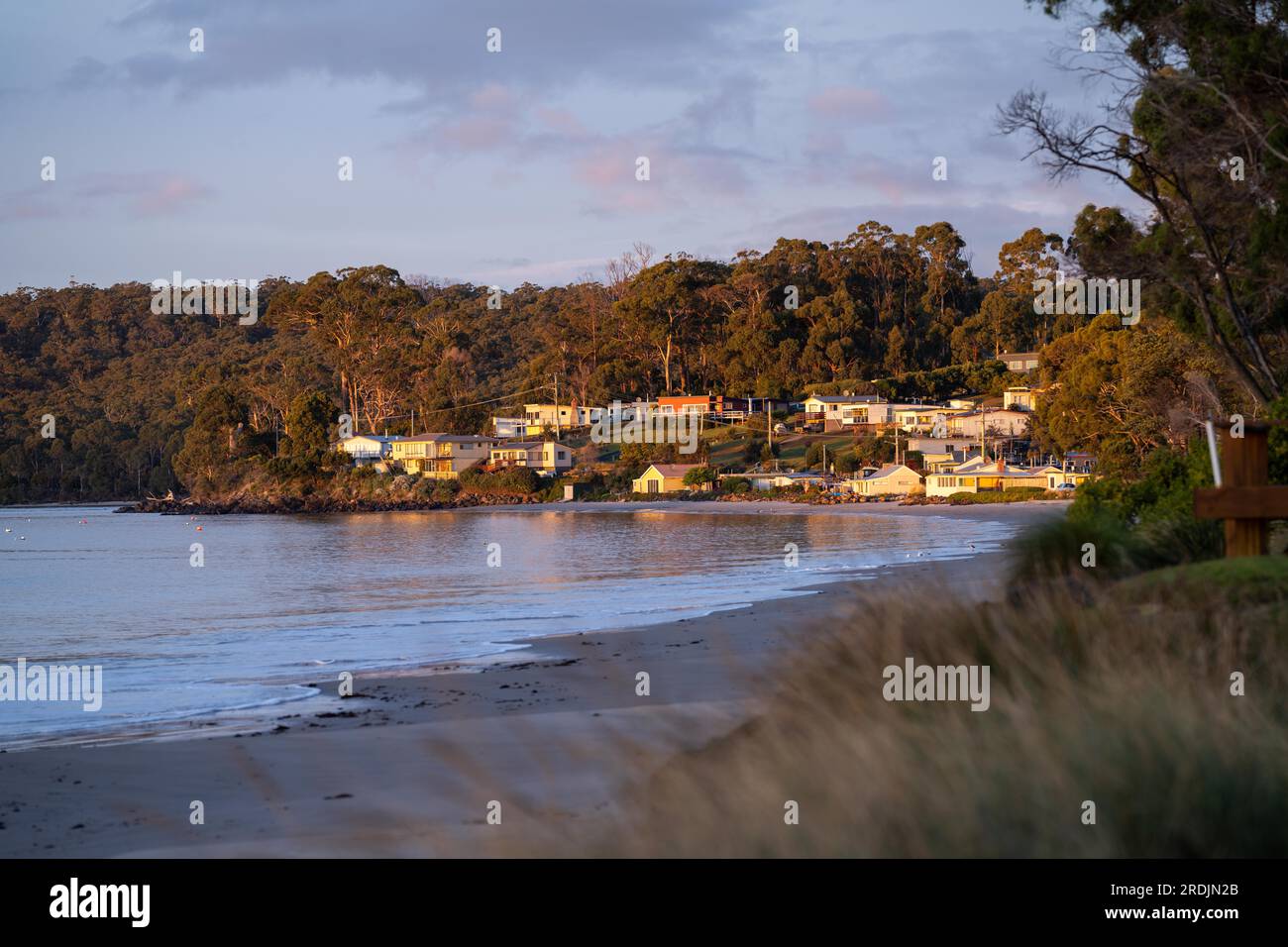 beach town with beach shacks next to the beach in australia Stock Photo ...